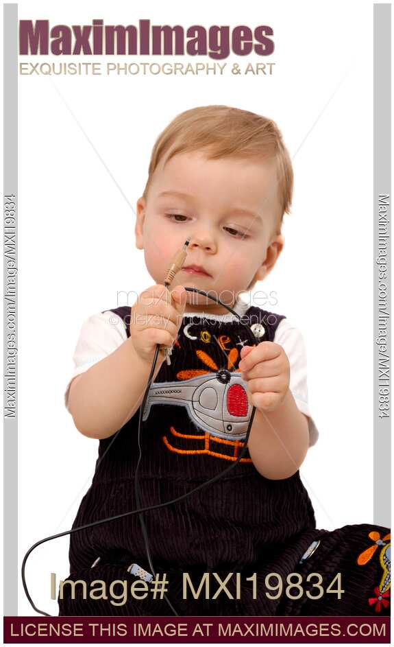 Photo of Baby Boy Playing with Electronics | Stock Image MXI19834