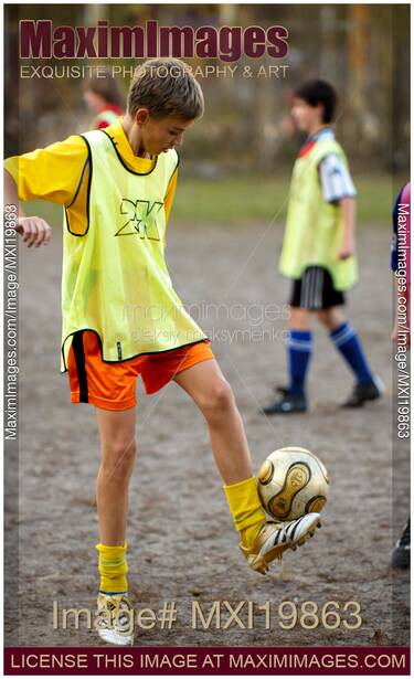 Photo of Boy practicing soccer in school | Stock Image MXI19863
