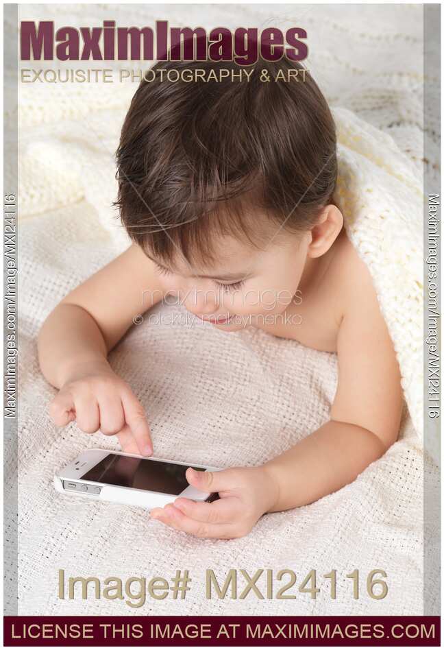 Photo of Child using iPhone | Stock Image MXI24116