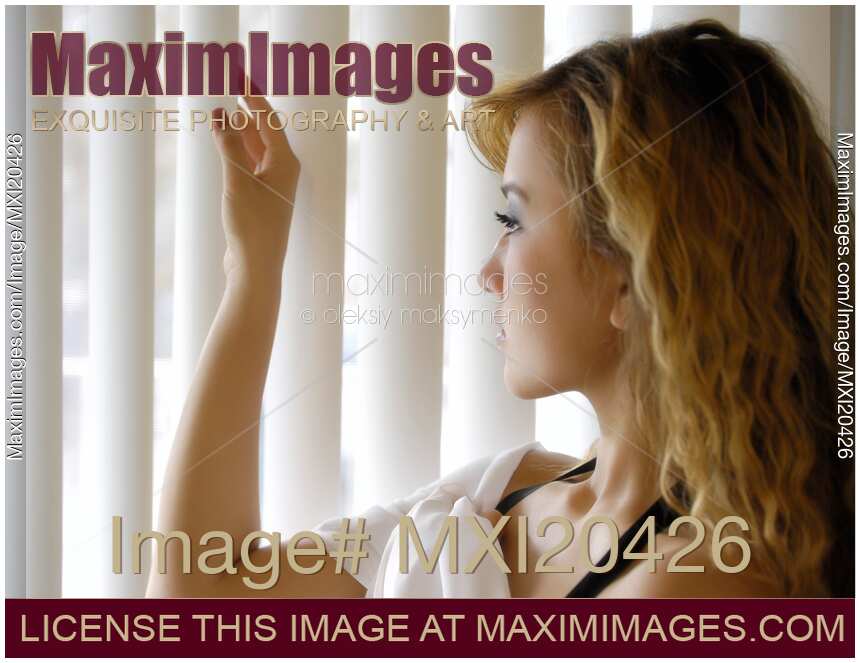 Photo of Face of young woman looking out of the window | Stock Image ...