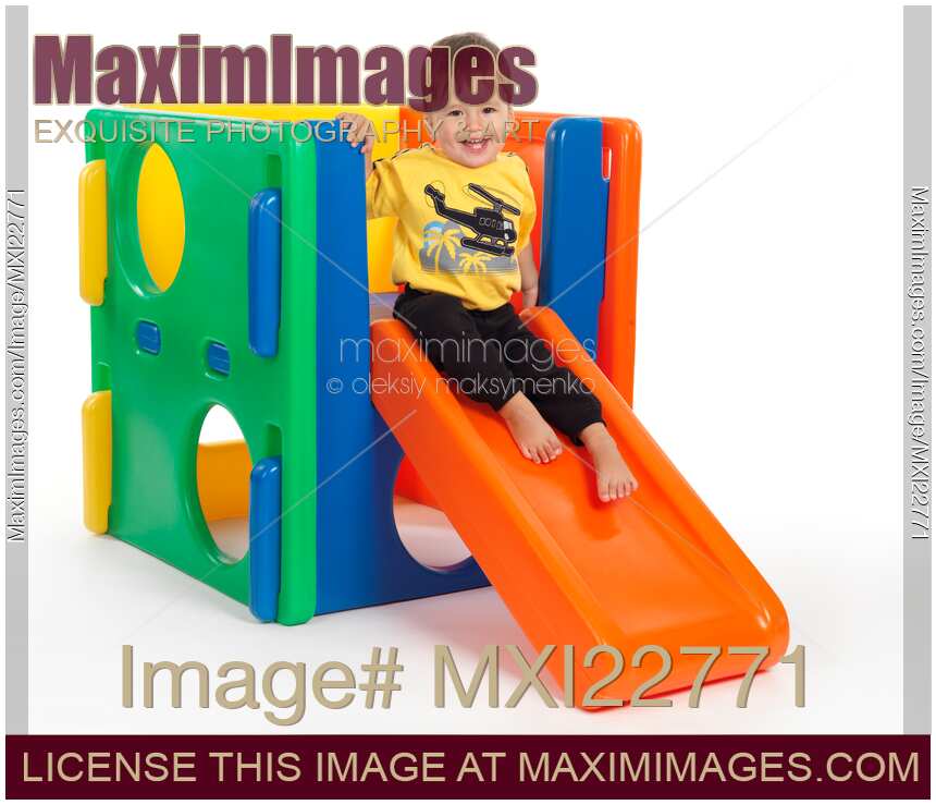 Photo of Happy Child on a Slide | Stock Image MXI22771