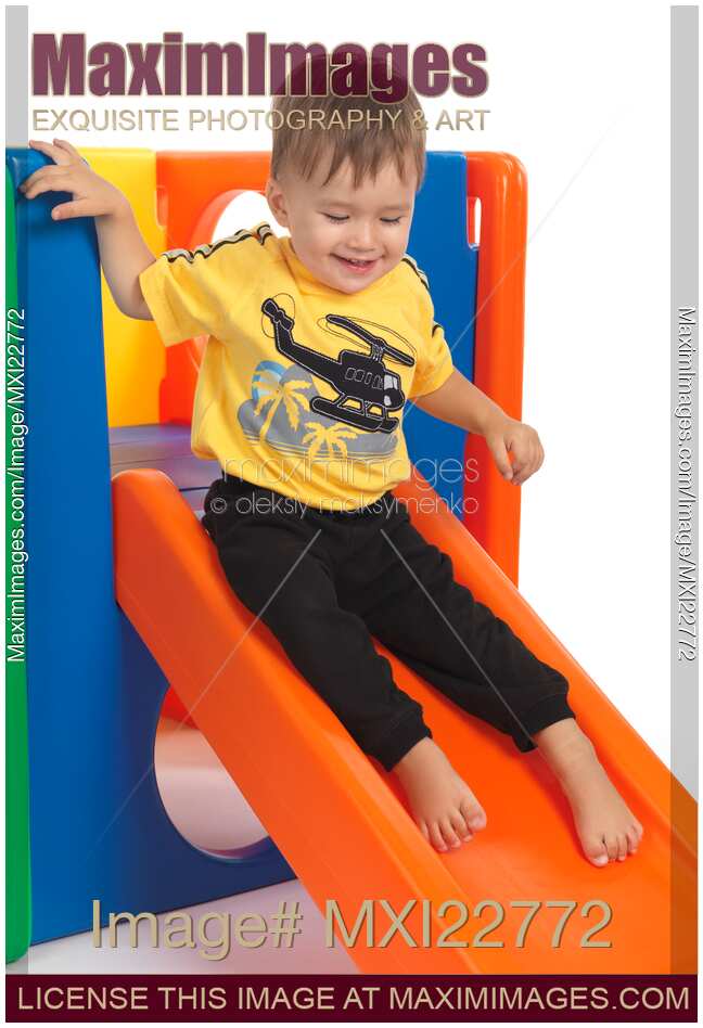 Photo of Happy Child on a Slide | Stock Image MXI22772