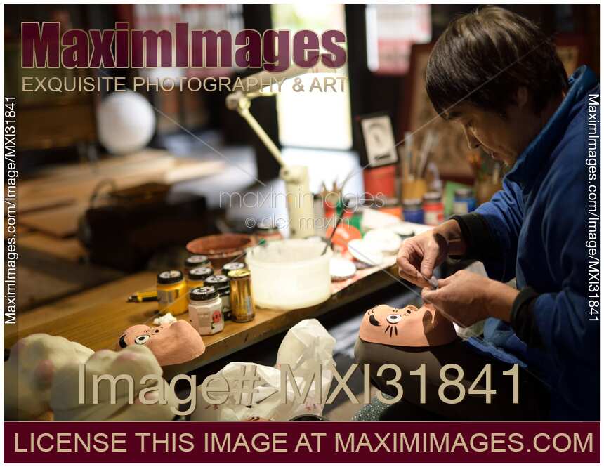 Photo of Japanese craftsman making Hyottoko masks | Stock Image MXI31841