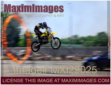 Photo of Motorcyclist Jumping Through a Ring of Fire | Stock Image MXI29025