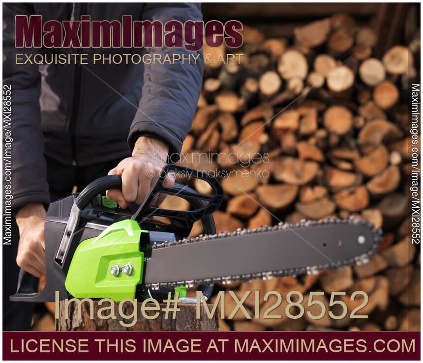 Photo of Person holding Electric Chainsaw | Stock Image MXI28552