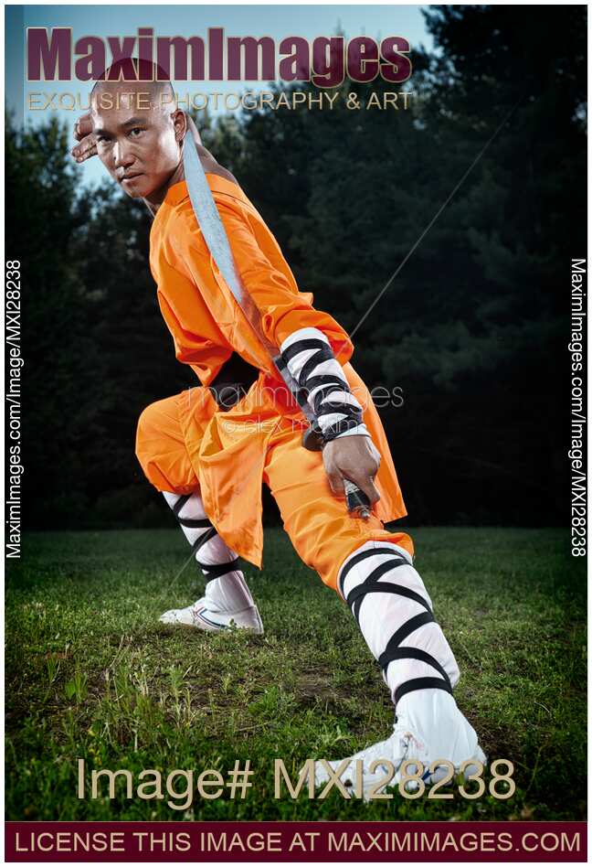 Stock photo: Shaolin warrior monk with a broad sword | MaximImages