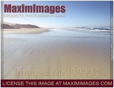 Photo of Surreal scenery of the sandy ocean shore at Pacific Rim ...