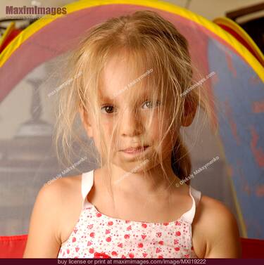Little girl with messed hair. Stock Photo MXI19222