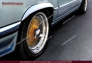 Classic car chrome rims with spokes. Stock Photo MXI19369