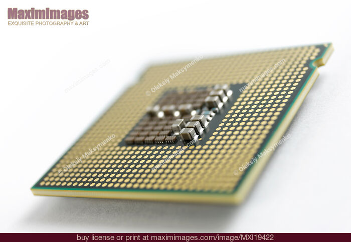 Intel Core 2 Quad Q6600 CPU closeup. Stock Photo MXI19422