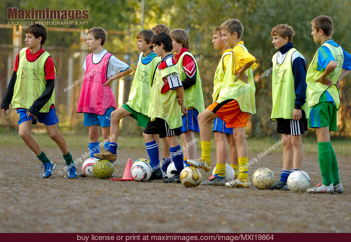 Children on a School Playground Practicing Soccer. Stock Photo MXI19864