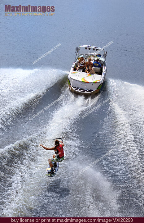 Teenage Girl Riding Wakeboard. Stock Photo MXI20293