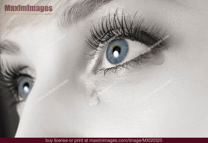 Close-up of tears coming from woman eyes. Stock Photo MXI20325