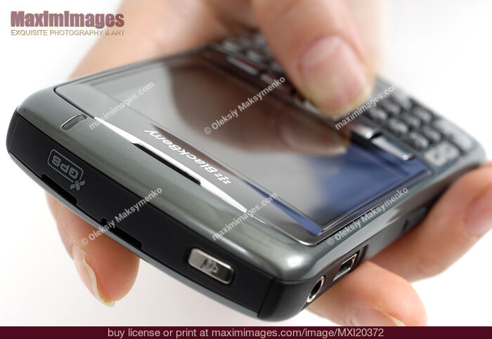 BlackBerry 8310 Curve Smartphone in a Hand. Stock Photo MXI20372