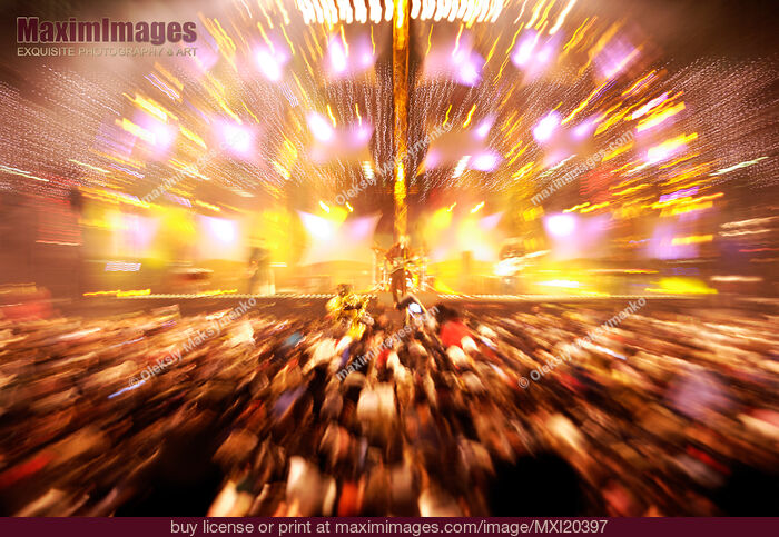 Rock Band Performing on a Stage Lit with Bright Lights. Stock Photo ...