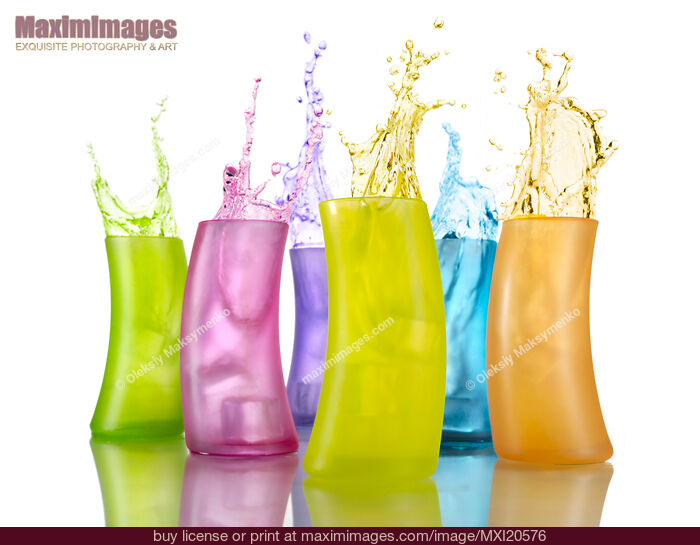 Colorful Drink Splashing from Glasses. Stock Photo MXI20576