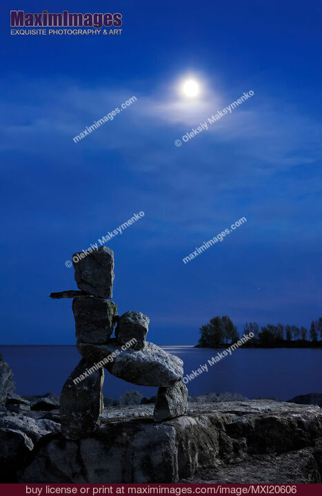 Stone Figure in Moonlight. Stock Photo MXI20606