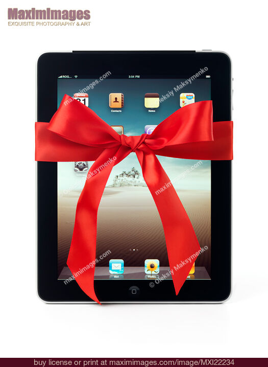 Apple iPad 3G Tablet with a Gift Bow. Stock Photo MXI22234