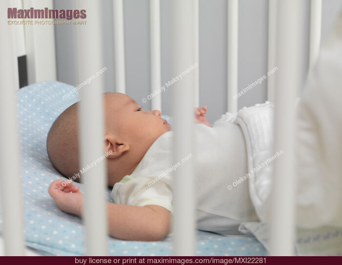 Baby Boy in a Crib. Stock Photo MXI22281