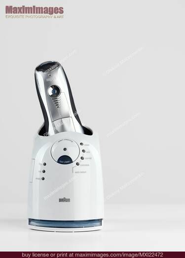 Electric Shaver with Self Cleaning System. Stock Photo MXI22472