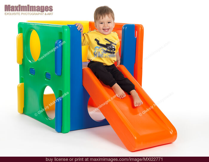 Happy Child on a Slide. Stock Photo MXI22771