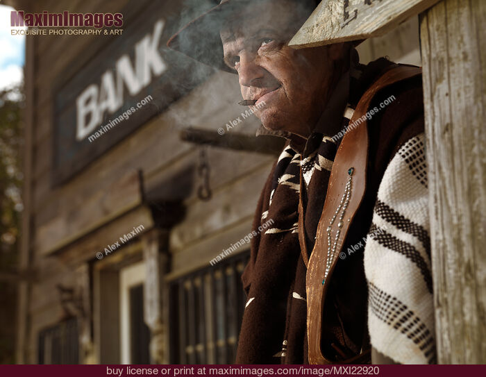 Cowboy Smoking a Cigar Outside of a Bank Building Notorious villain in ...