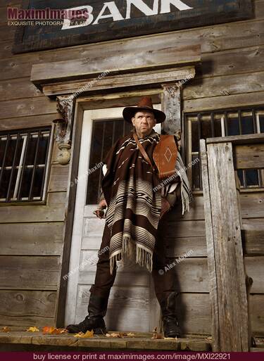 Cowboy Standing Outside of a Bank Building Notorious villain and robber ...