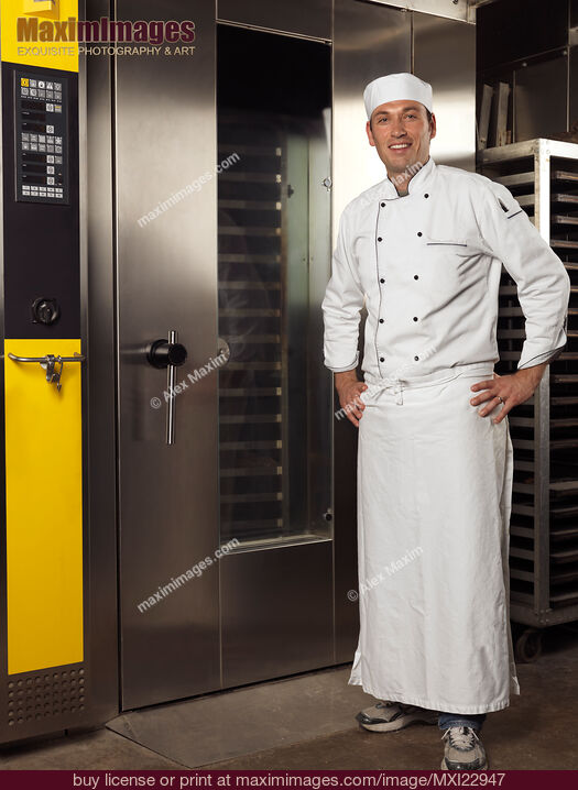 Baker Standing at a Bakery's Oven. Stock Photo MXI22947