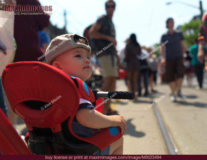 Baby Boy on a Tricycle in the Street. Stock Photo MXI23494