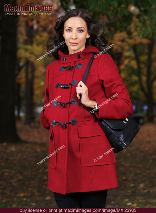 Woman in a Red Coat in Fall. Stock Photo MXI23903