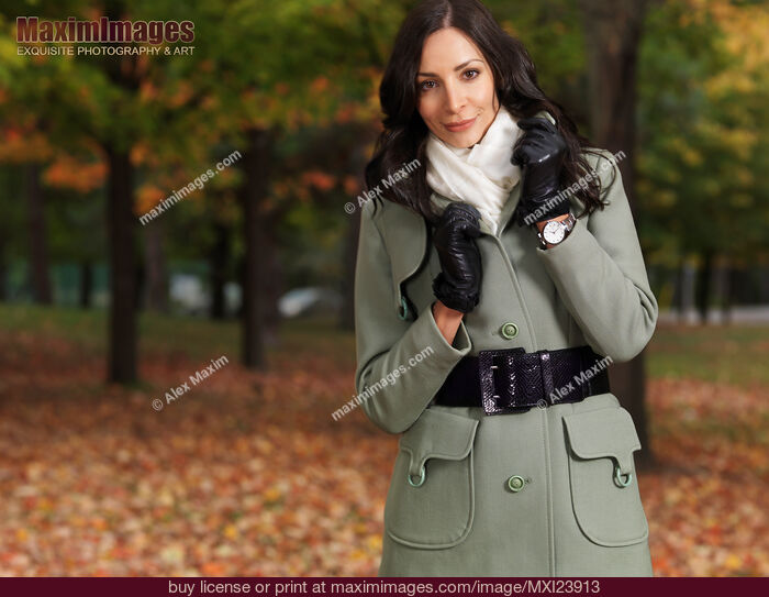 Woman Wearing a Green Coat in Fall. Stock Photo MXI23913