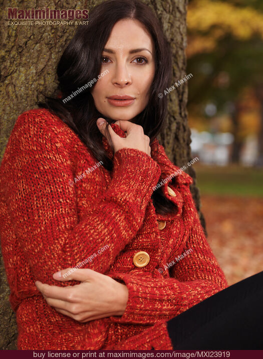Woman Cuddling in a Sweater in Fall. Stock Photo MXI23919