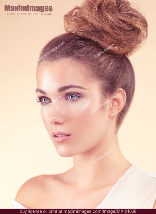 Beautiful young woman with natural look and updo. Stock Photo MXI24608