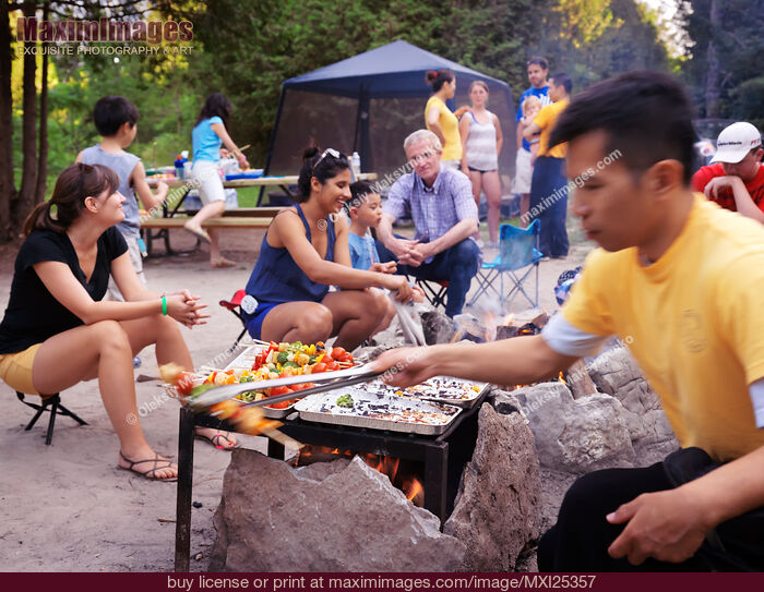 Group of people camping in park. Stock Photo MXI25357