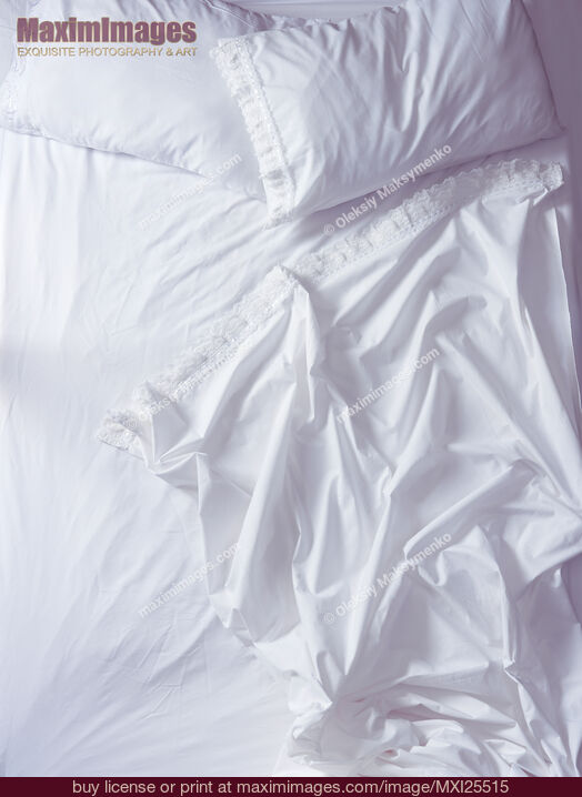 Unmade bed view from above. Stock Photo MXI25515
