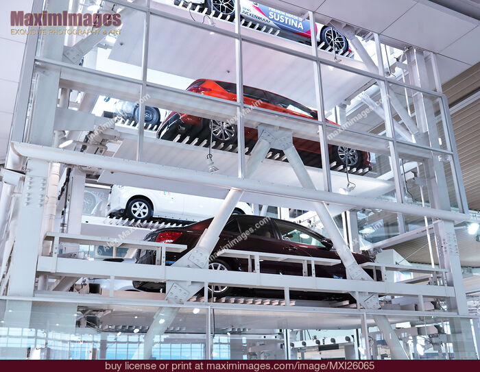 Cars in multi-level parking garage. Stock Photo MXI26065