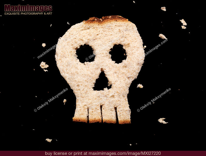Skull made of bread on black. Stock Photo MXI27220