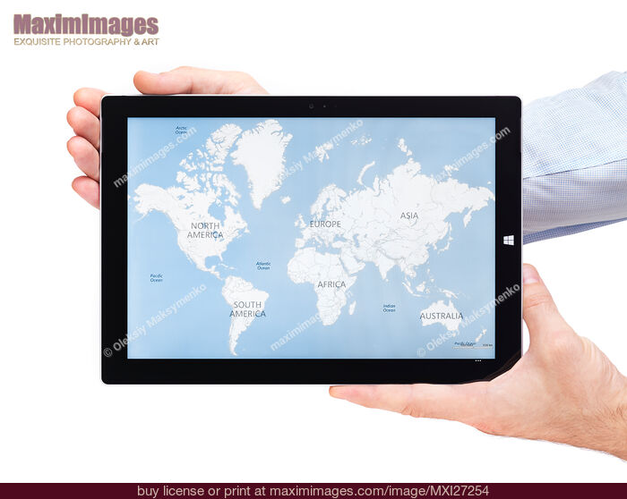 Person holding Microsoft Surface tablet with world map on display ...