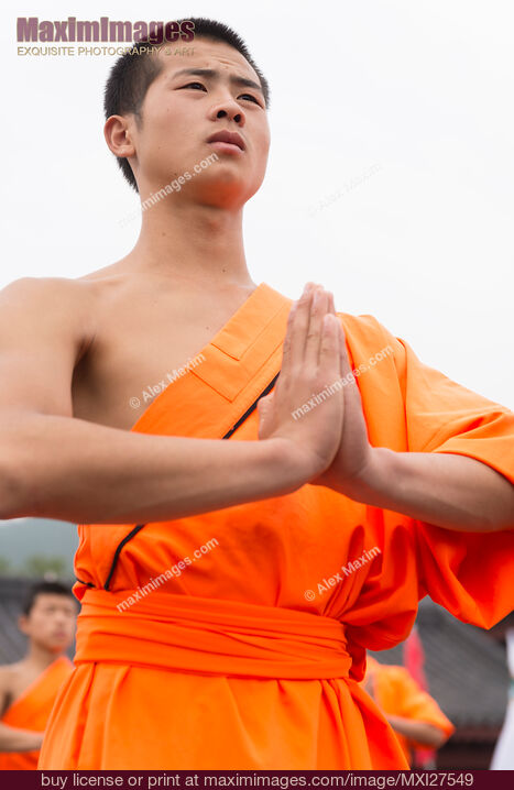 Shaolin Kung Fu student with folded hands in China. Stock Photo MXI27549