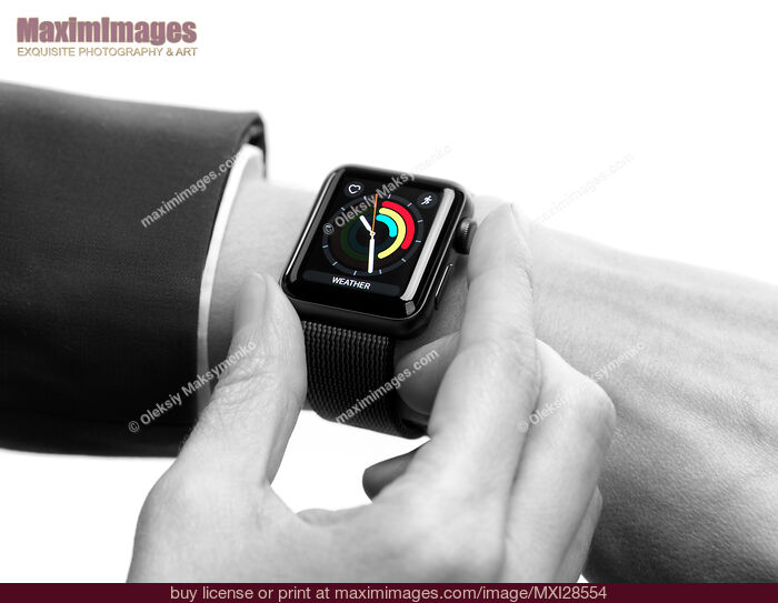 Woman hand with Apple Watch showing daily activity. Stock Photo MXI28554