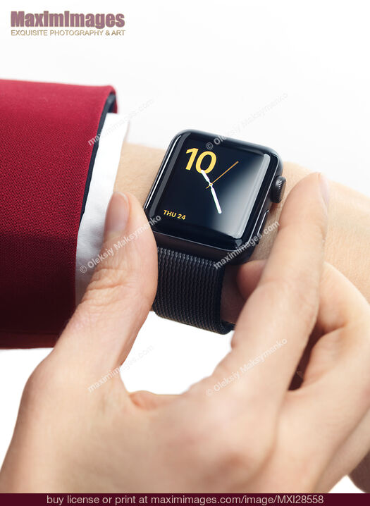 Woman hand wearing suit and Apple Watch. Stock Photo MXI28558