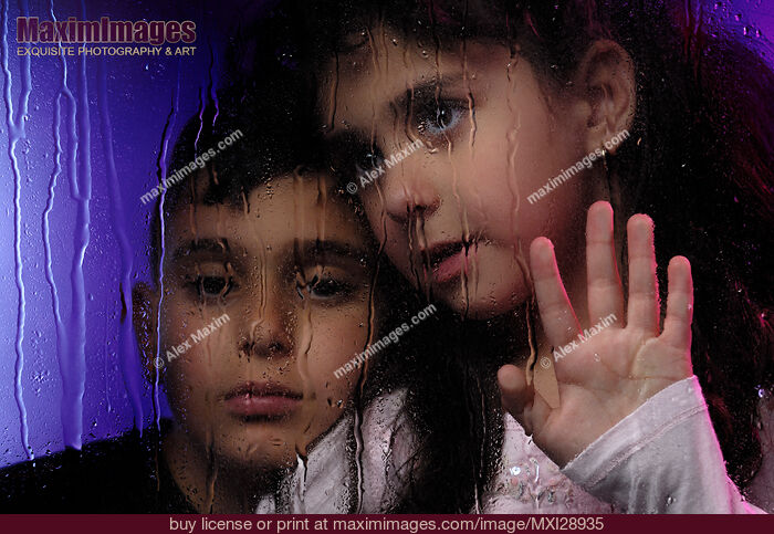 Children Behind Window Pane. Stock Photo MXI28935