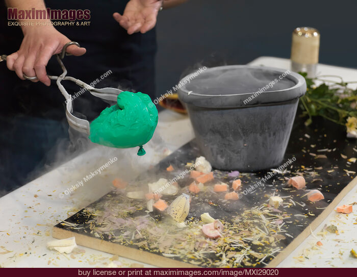 Person Taking a Shrunk Air Balloon out of Liquid Nitrogen. Stock Photo ...