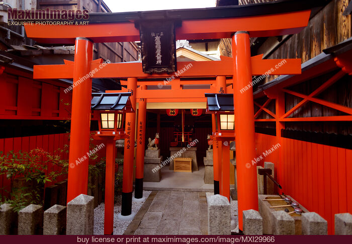 Orange Torii of a small Inari Shinto shrine in Kyoto. Stock Photo MXI29966
