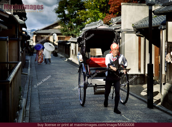 Japanese rickshaw on an old street in Kyoto Japan. Stock Photo MXI30008