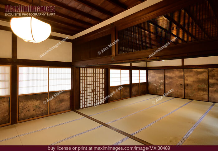 Traditional Japanese temple hall interior with tatami mats and painted ...