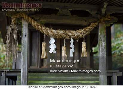 Photo of Rural Shinto shrine detail Shimenawa rope and paper Shide in ...