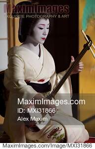 Photo of Geisha Geiko playing Shamisen traditional Japanese musical ...