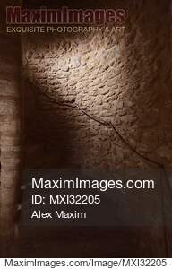 Photo of Stone steps of a spiral staircase in a dungeon of a medieval ...