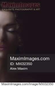 Photo of Beautiful tranquil woman face with closed eyes half hidden by ...